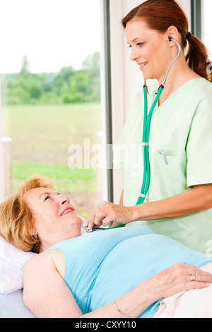 Family female woman doctor with a stethoscope holds folder with ...