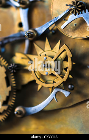 Cogs in a clock Stock Photo - Alamy