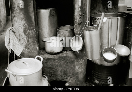 Traditional Vietnamese metal kitchen utensils for preparing and serving ...