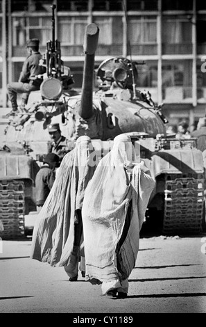 Afghan women wearing traditional full body covers known as burqa learn ...