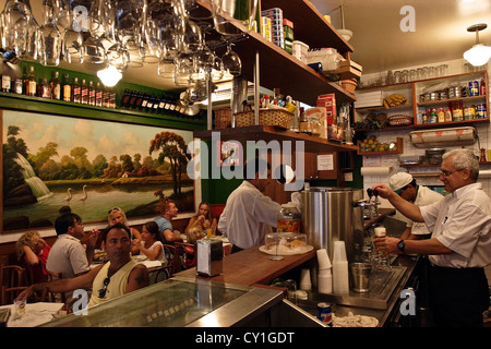 People drinking chope ( draught beer ) at Bracarense Bar served by ...