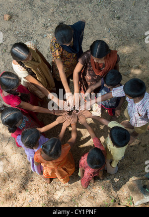 Indian childrens hands in a circle. India Stock Photo - Alamy