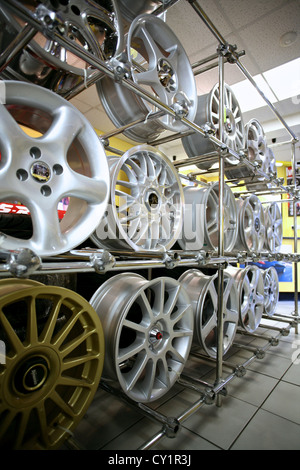 car Alloy wheels on display at an automotive fair Stock Photo - Alamy
