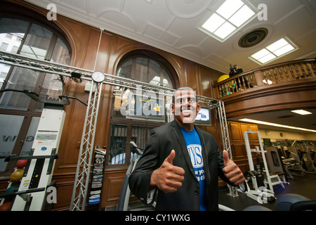 Exercisers dressed in suits and Barack Obama and Mitt Romney masks run ...