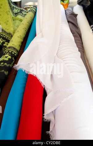 Colourfult bolts of cloth for sale in local open air market Stock Photo ...
