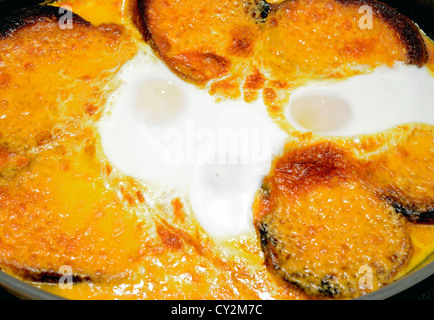 A Welsh rabbit, or Welsh rarebit - a mix of cheddar cheese and egg with ...