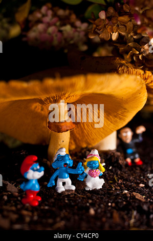 Smurfs gathered for a wedding under a mushroom with Gargamel hiding in ...
