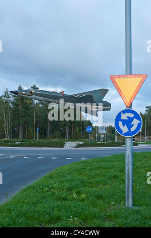 Fighter jet flying over a roundabout Stock Photo - Alamy