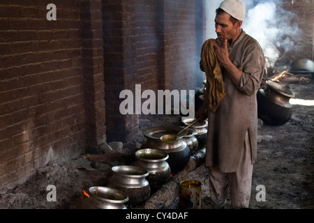 Wazas, traditional Kashmiri cooks, prepare a Wazwan a Kashmiri feast ...