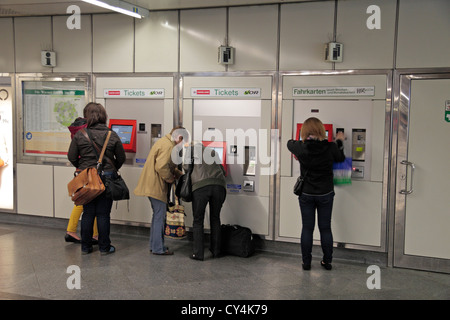 People using train ticket machines at Waterloo Station, London, England ...