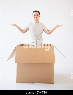 smiling funny man popping out from a picture frame Stock Photo - Alamy