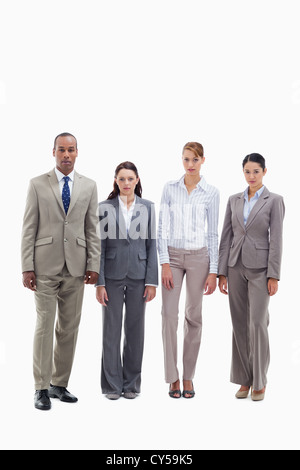 Group of serious business team standing together Stock Photo - Alamy