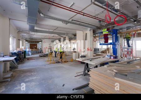 Construction workers working on interior of a building Stock Photo ...