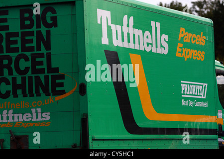 Side view of Tuffnells Parcel Express business hgv lorry truck towing ...
