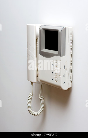 Intercom phone receiver on gray concrete background. handset hanging on ...