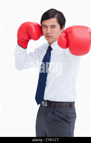 Attacking fist of tradesman in boxing glove Stock Photo - Alamy