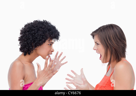 Teenagers standing upright while shouting Stock Photo - Alamy