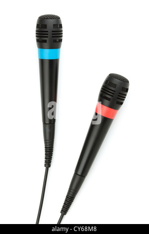 Two black microphones isolated on a green background Stock Photo - Alamy