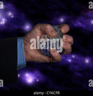 Hand squeezing oil from the planet. Earth image courtesy of NASA Stock ...