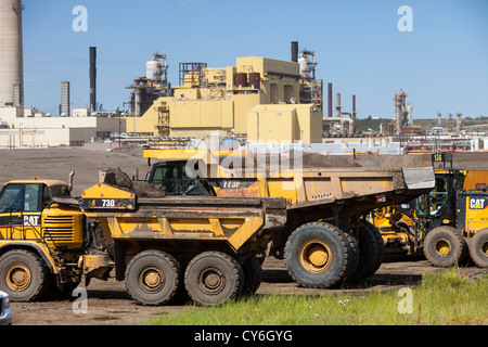 Massive dump trucks by the Syncrude upgrader plant. The tar sands are ...