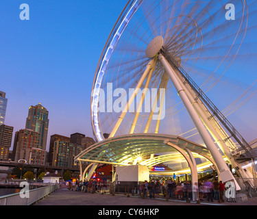 People ride the ferris wheel at the Great American State Fair, with the ...