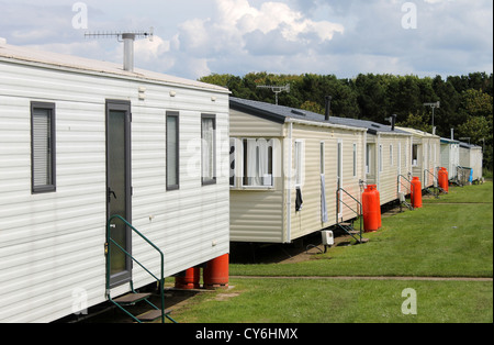 row of static caravan trailers in a holiday park for rent Stock Photo ...