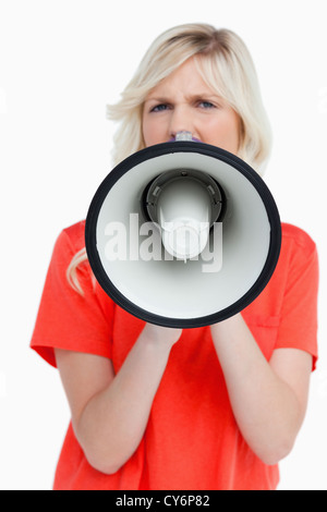 Blonde teenager woman holding megaphone with happy face smiling doing ...