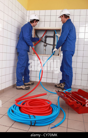 Water supply valve and lines of metallic and fiber optic cables. The ...
