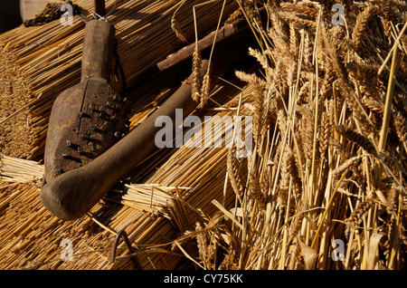 Straw thatch and thatching tools Stock Photo - Alamy