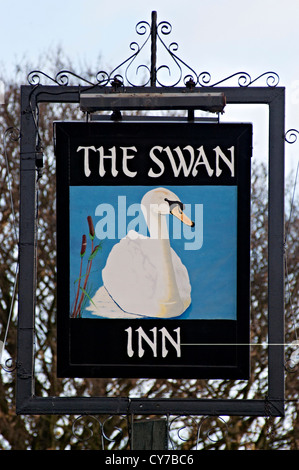Traditional hanging pub sign at The Swan public house and hotel - a ...