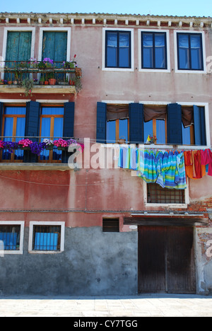 Wet washing hanging on a clothes line during the rain Stock Photo - Alamy
