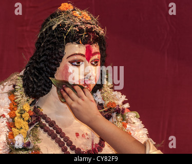 Bengali boy Hindu devotee offering God Kartika on the traditional ...