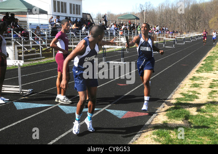 High school relay race in track and field meet Stock Photo - Alamy