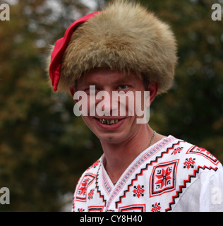 man in Ukrainian embroidered shirt on flag background Stock Photo - Alamy