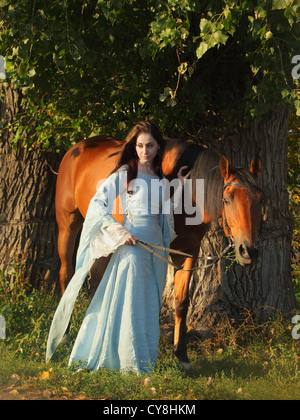 woman in medieval dress with horse in forest Stock Photo - Alamy