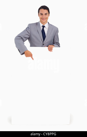 Good-looking man holding a big poster Stock Photo - Alamy