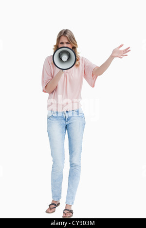 Woman standing with megaphone Stock Photo - Alamy