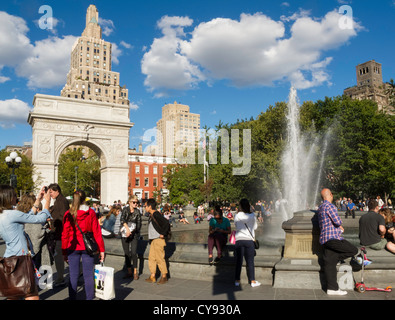 Washington Square Park fountain with crowds of people in Greenwich ...