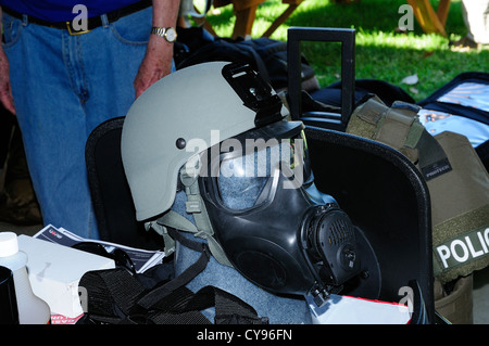 Police riot helmet and gas mask on display at convention Stock Photo ...