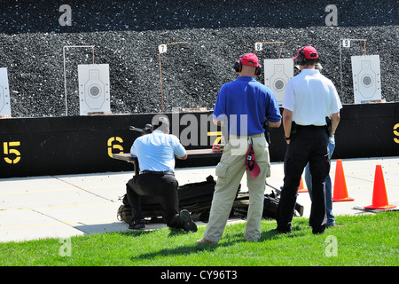 Gunman test firing automatic rifle at the FBI shooting range in Chicago ...