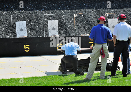 Gunman test firing automatic rifle at the FBI shooting range in Chicago ...