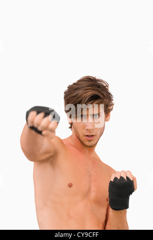 Martial arts fighter in offensive pose Stock Photo - Alamy