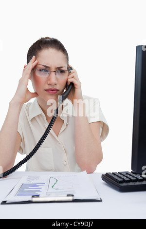 Worried woman making a phone call isolated on white background Stock ...