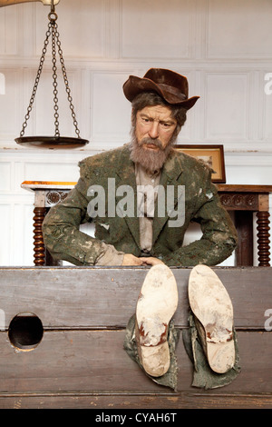 Man in the stocks Stock Photo - Alamy