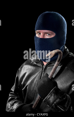 male burglar wearing ski mask holding large number of US money Stock ...