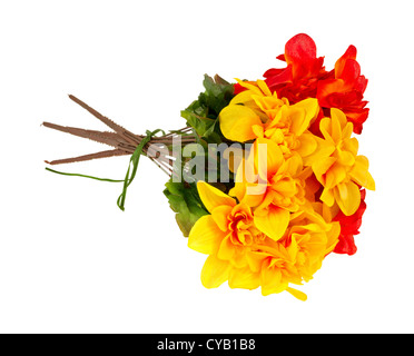 An orange ribbon tied on a green branch of a tree against the ...