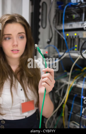 confused computer female technician looking at motherboard Stock Photo ...
