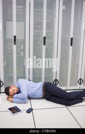 Man sleeping in data center Stock Photo - Alamy