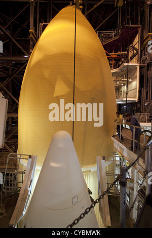 Space shuttle Atlantis' twin solid rocket boosters and three main engines ignite to propel the ...