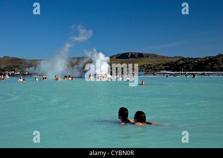 Tourists and visitors enjoy outdoor geothermal swimming pool at the ...